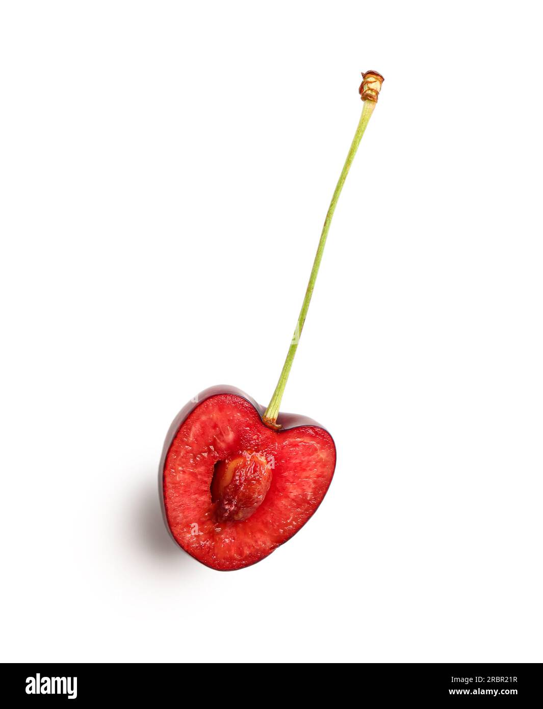 Half of red sweet cherry on white background Stock Photo - Alamy