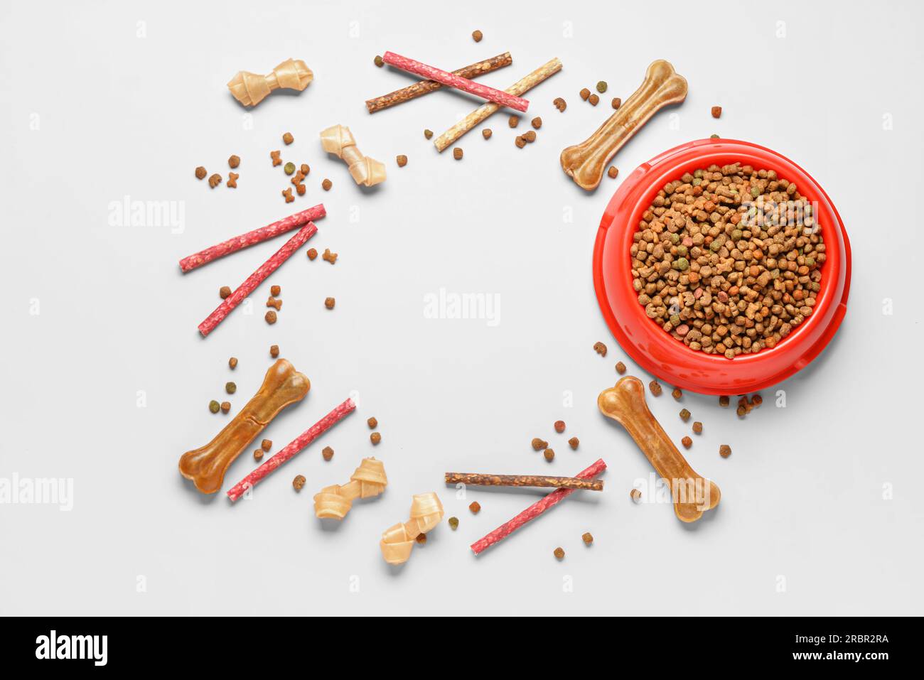 Frame made of different dog food on light background Stock Photo - Alamy