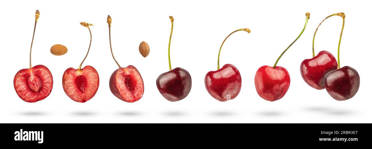 A set of cherries on a white isolated background. Pitted halves and ...