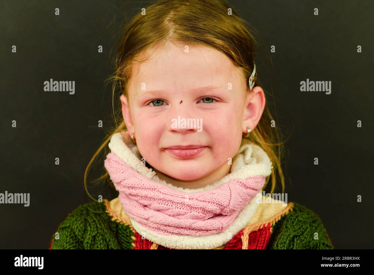 Portrait of a small girl on black background. Girl wears retro colorful ...