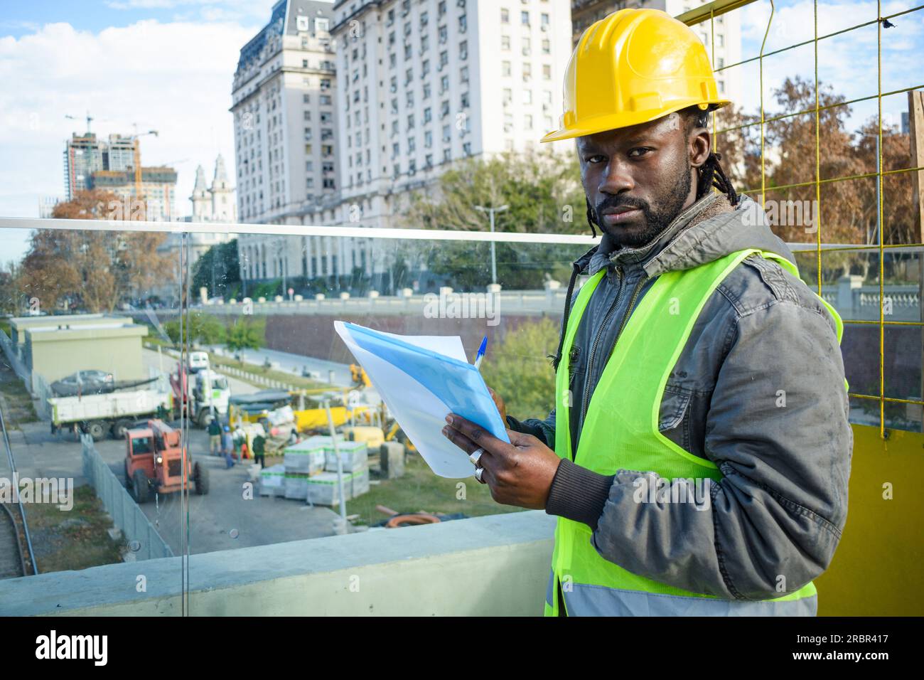 portrait of African ethnicity male engineer wearing safety helmet and ...
