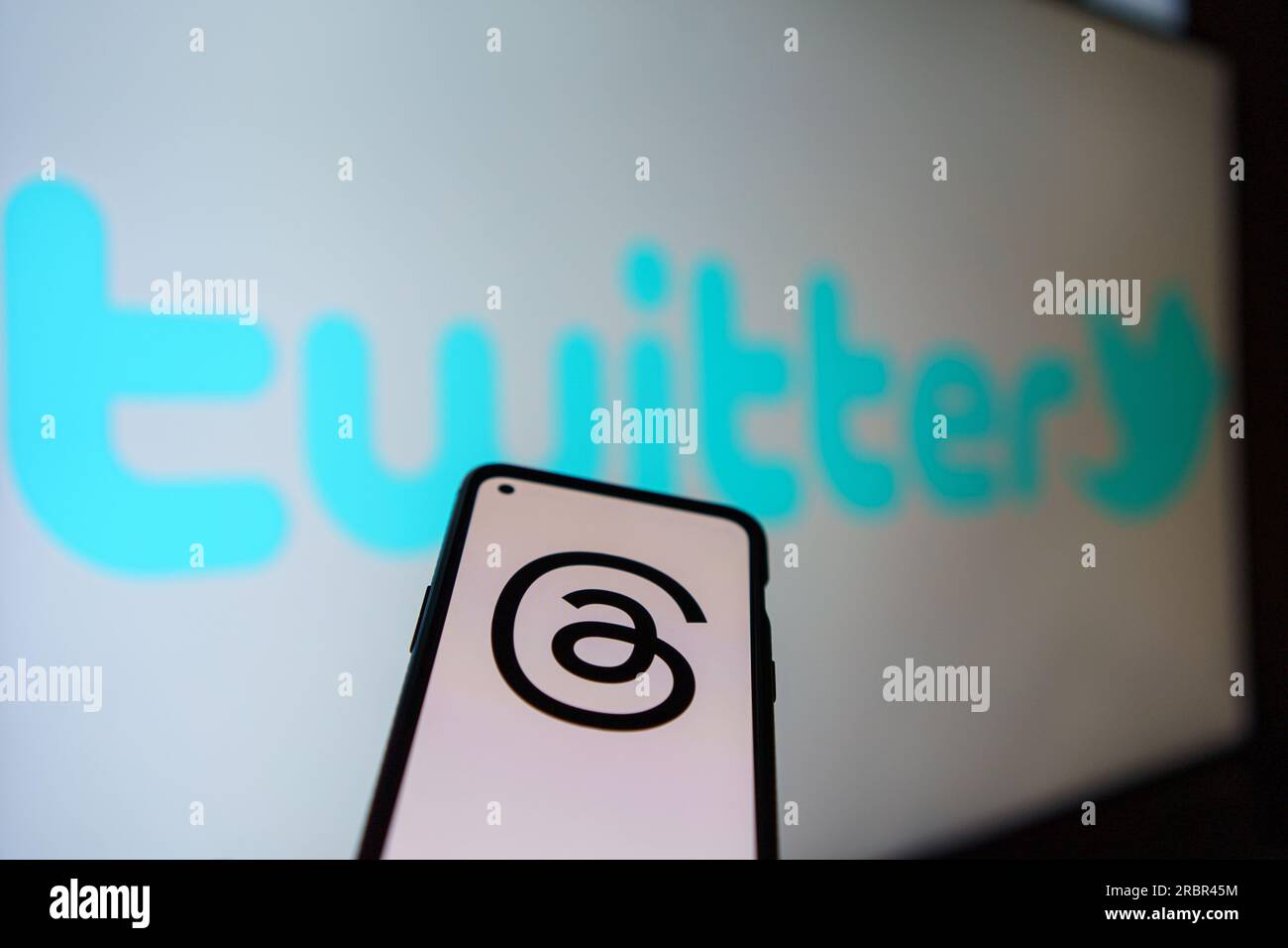 Threads logo on screen, Twitter logo in the background Stock Photo - Alamy