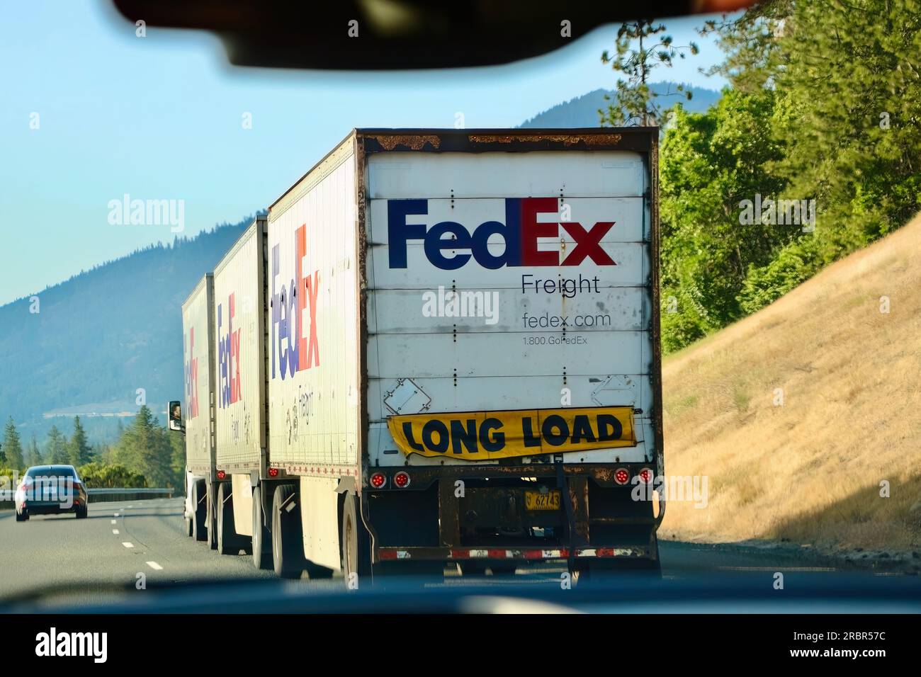 FedEx Freight LTL Shipping delivery truck with triple trailers and a ...