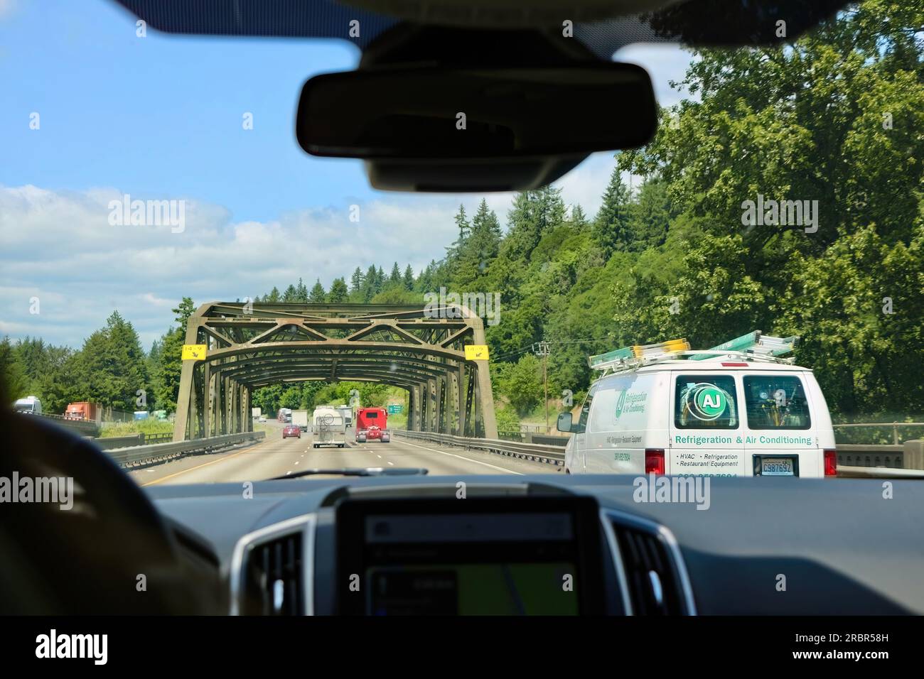 Traffic with steel warren type truss bridge on Interstate 5 North ...