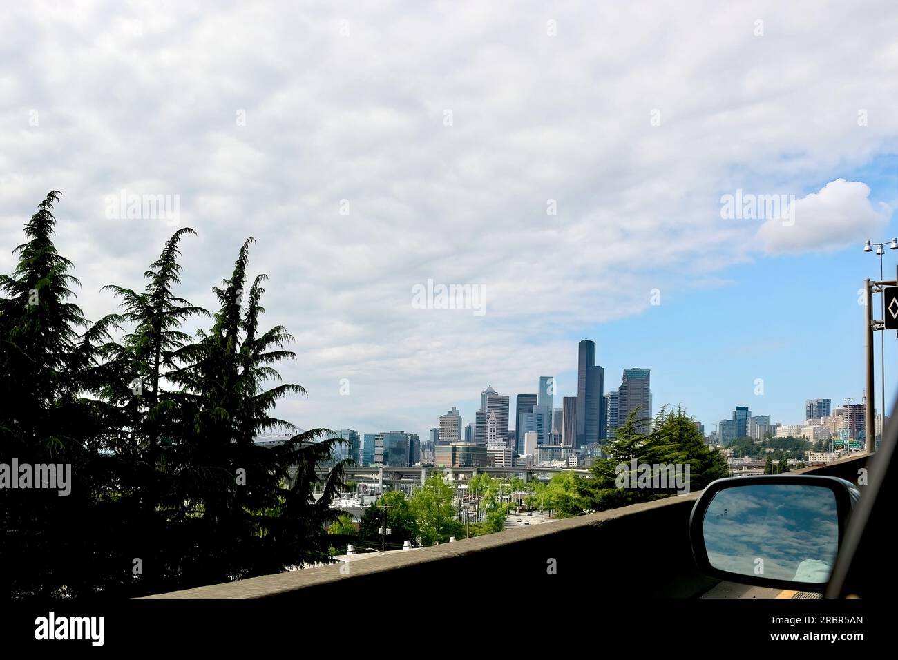 View of the city skyline from inside a car driving north on Interstate ...