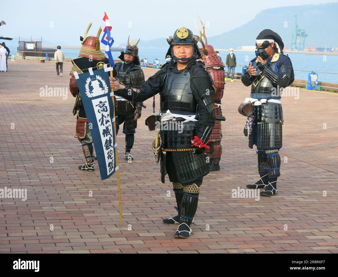Samurai warriors in full costume are on the quayside at Takamatsu to ...