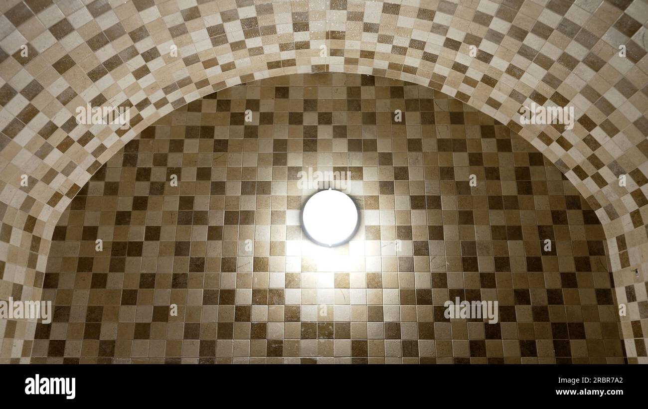 Wet sauna, hammam type. Sauna interior with yellow small tiles. Hamam ...