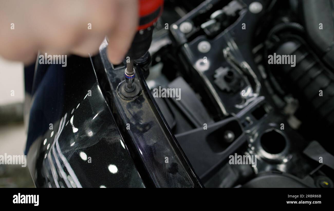 Car repair master tightens part hi-res stock photography and images - Alamy