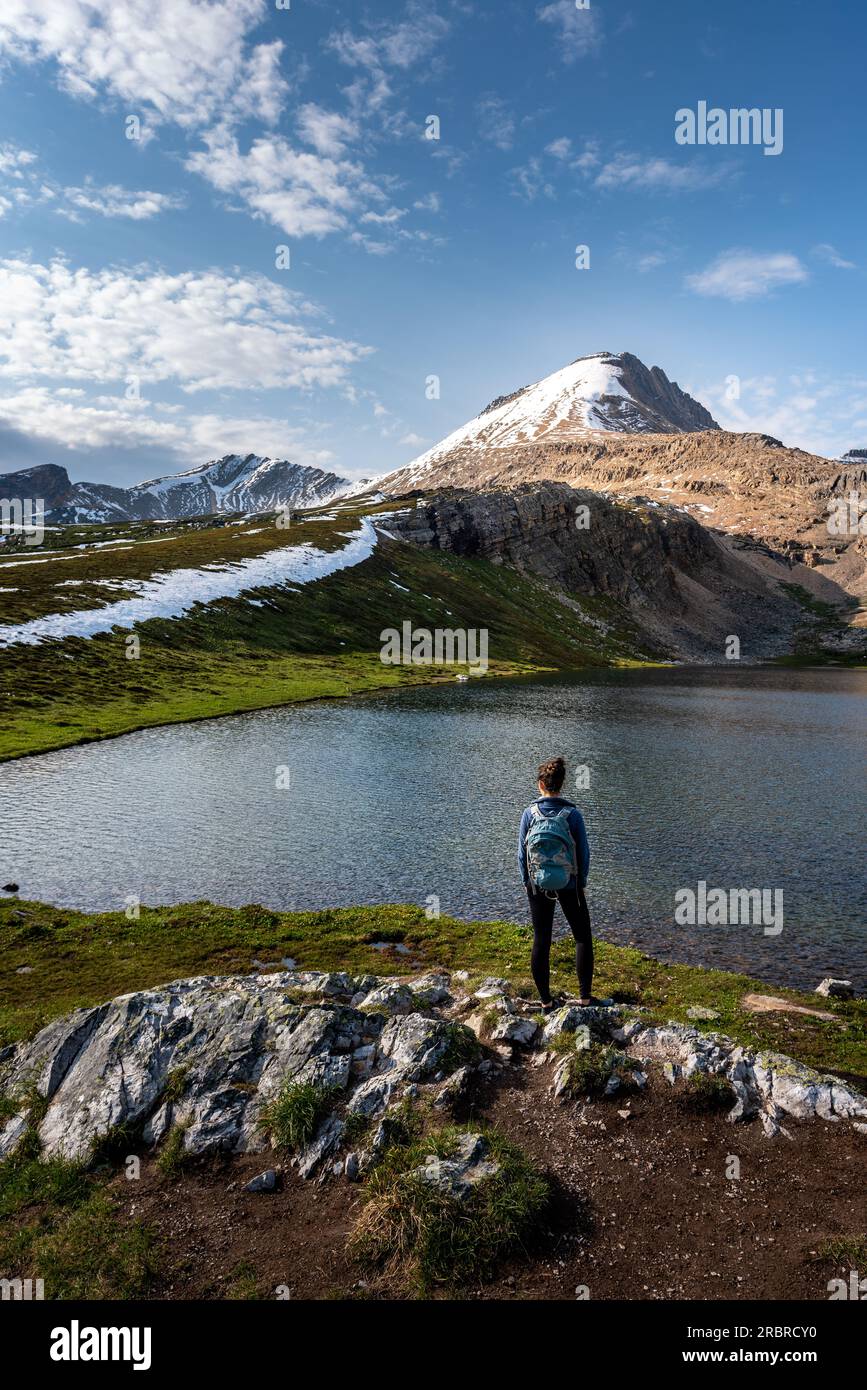 Backpacker Girl admires beautiful Helen Lake and Cirque Peak Banff ...