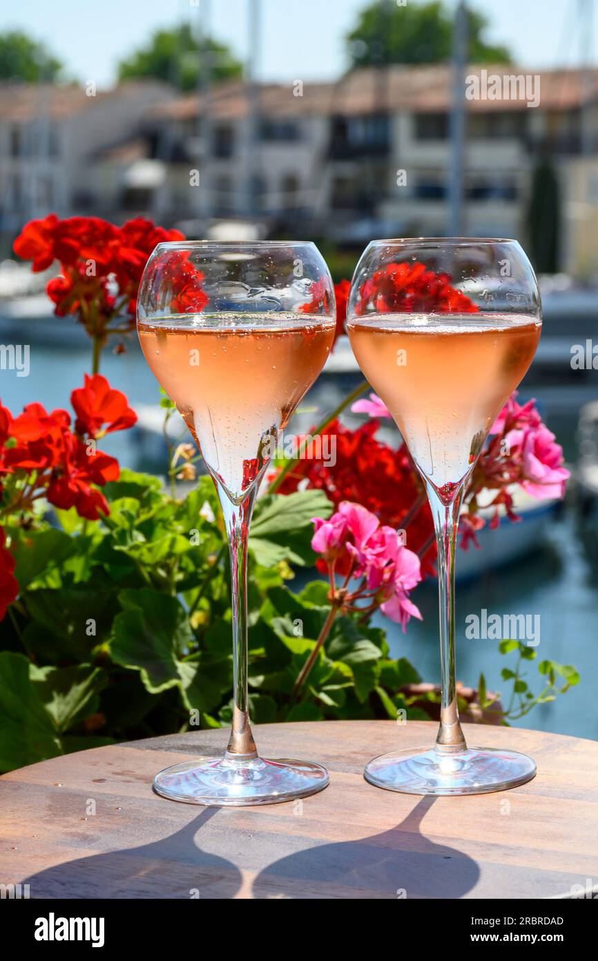 Summer party, drinking of French brut rose champagne sparkling wine in ...