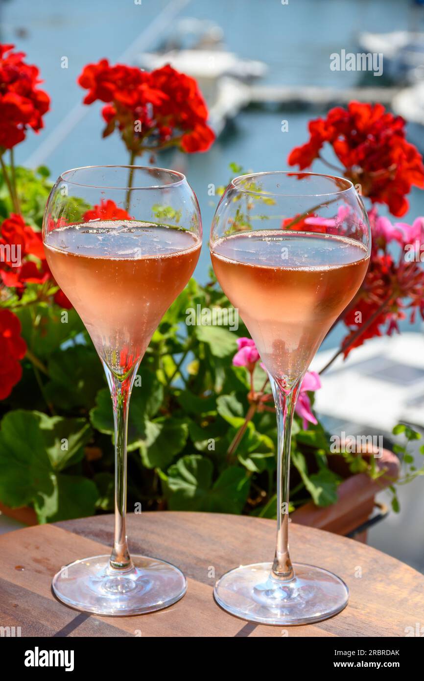 Summer party, drinking of French brut rose champagne sparkling wine in ...
