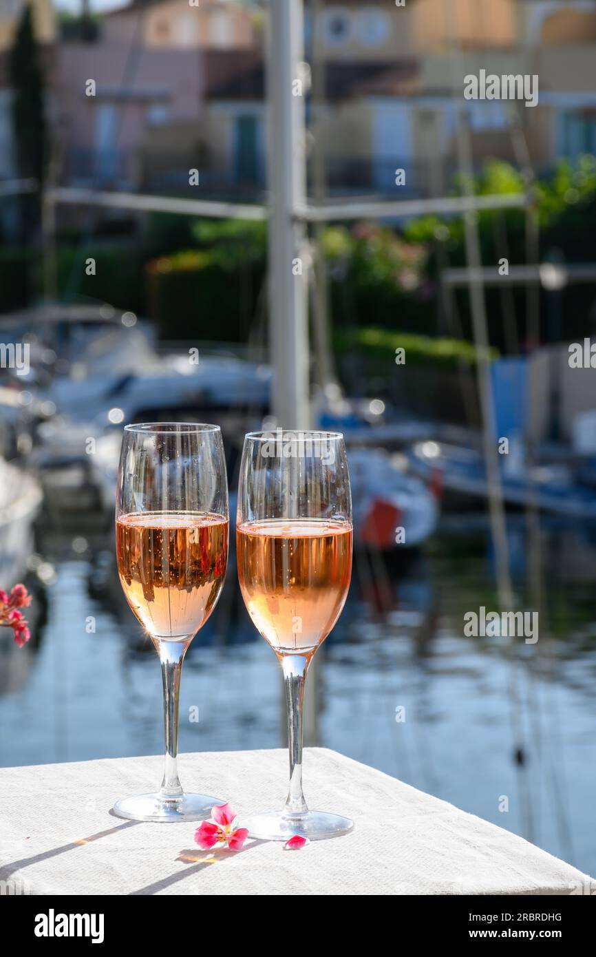 Summer party, drinking of French brut rose champagne sparkling wine in ...
