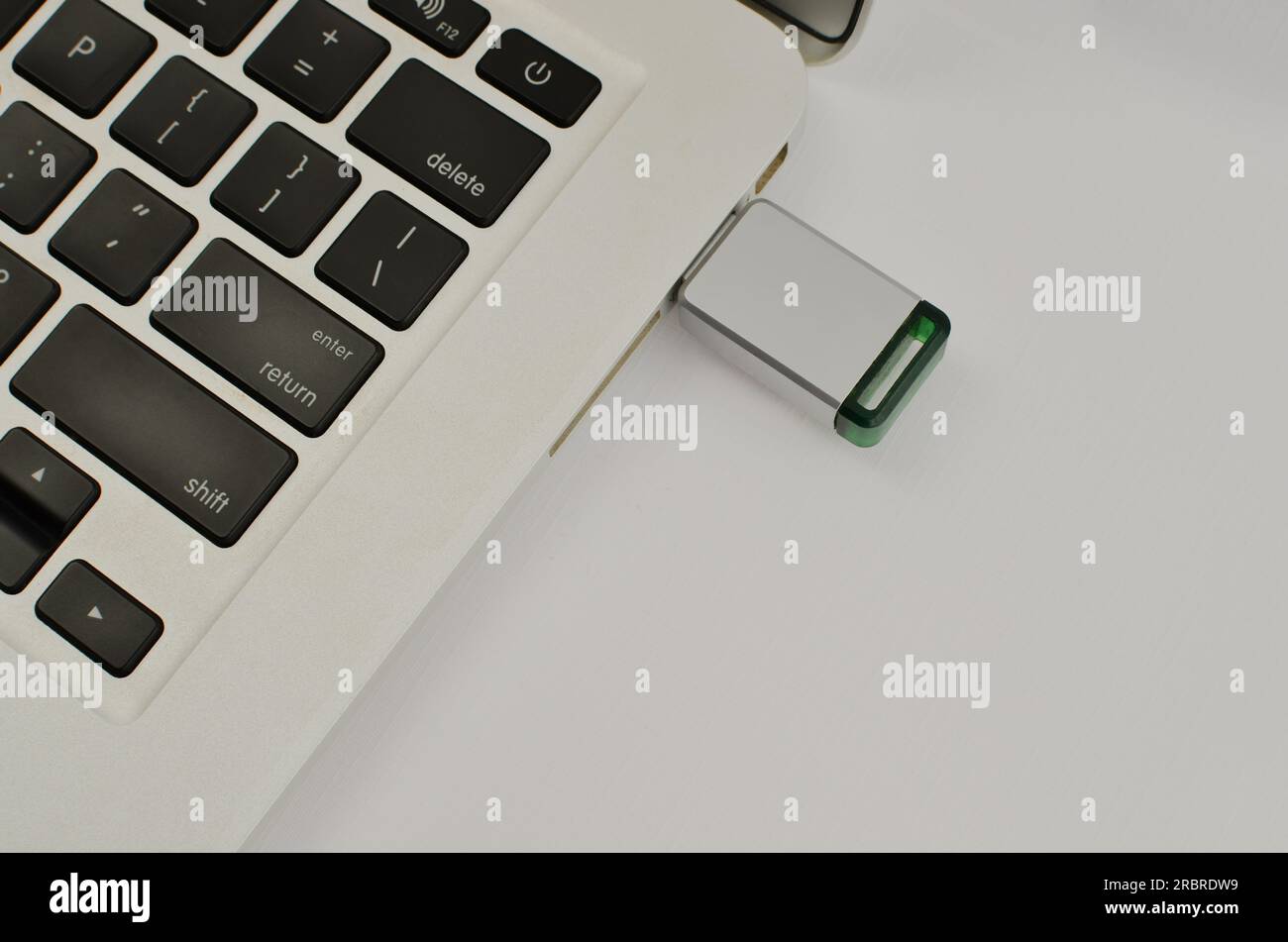 Pendrive connected to the laptop, symbolizing the perfect union between ...