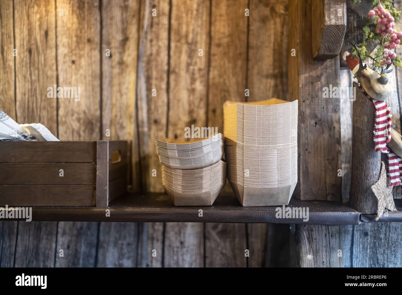 Stacked paper plates on a shelf of a christmas market stall Stock Photo ...