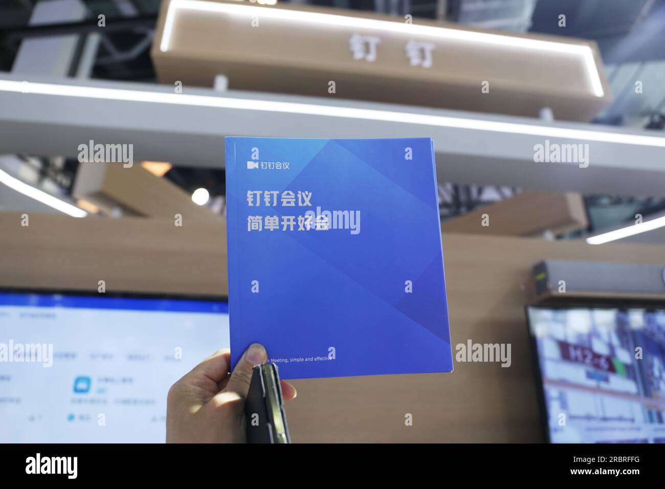 SHANGHAI, CHINA - JULY 8, 2023 - Visitors visit Dingding booth at the ...