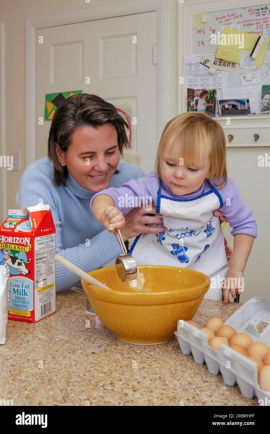 A mom and daughter bake together Stock Photo - Alamy