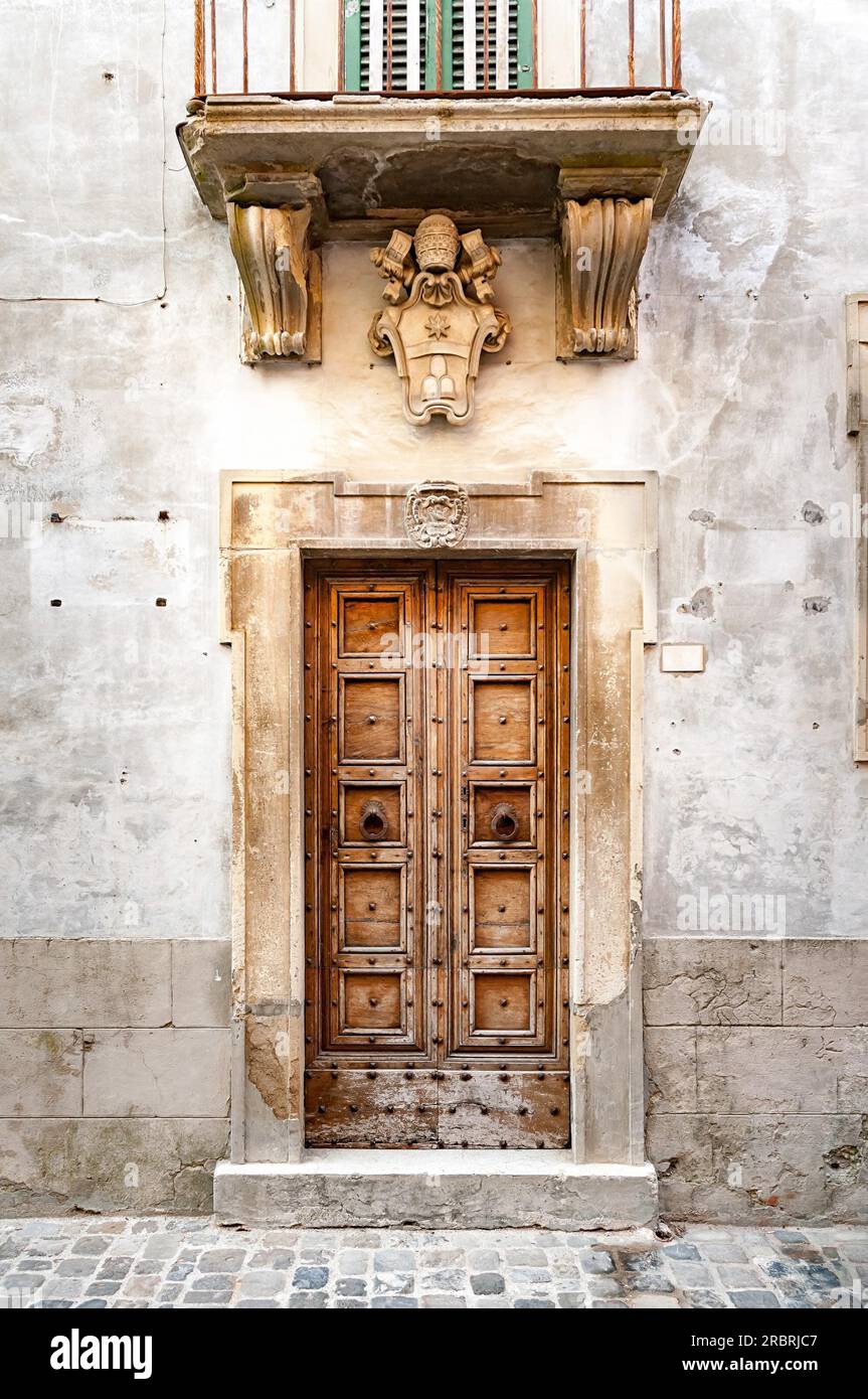 Coat of arms of Pope Clement XI above a door in the city of ...
