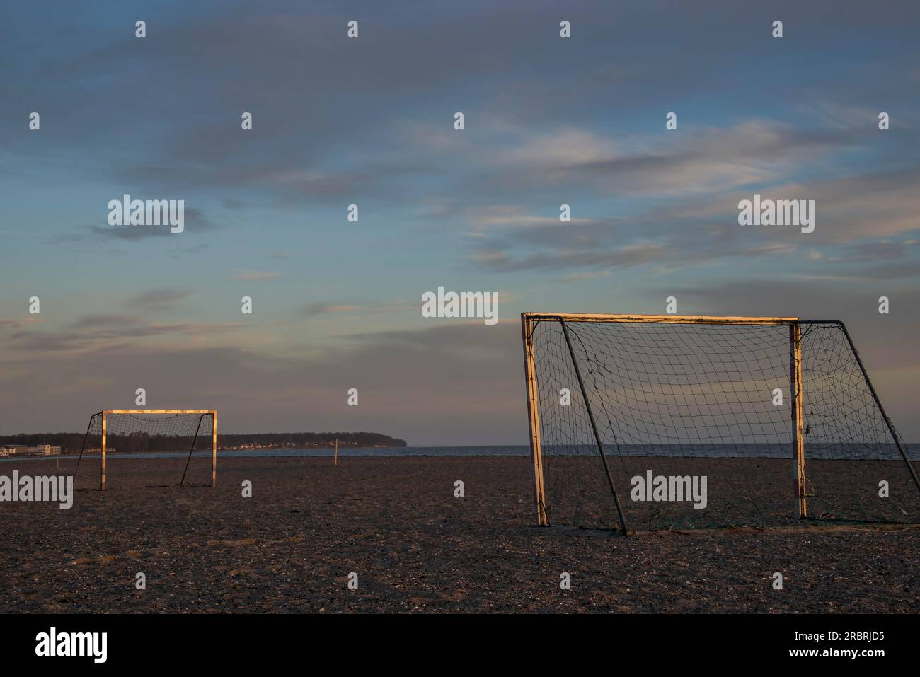 Two goals on a beach at sunrise Stock Photo - Alamy