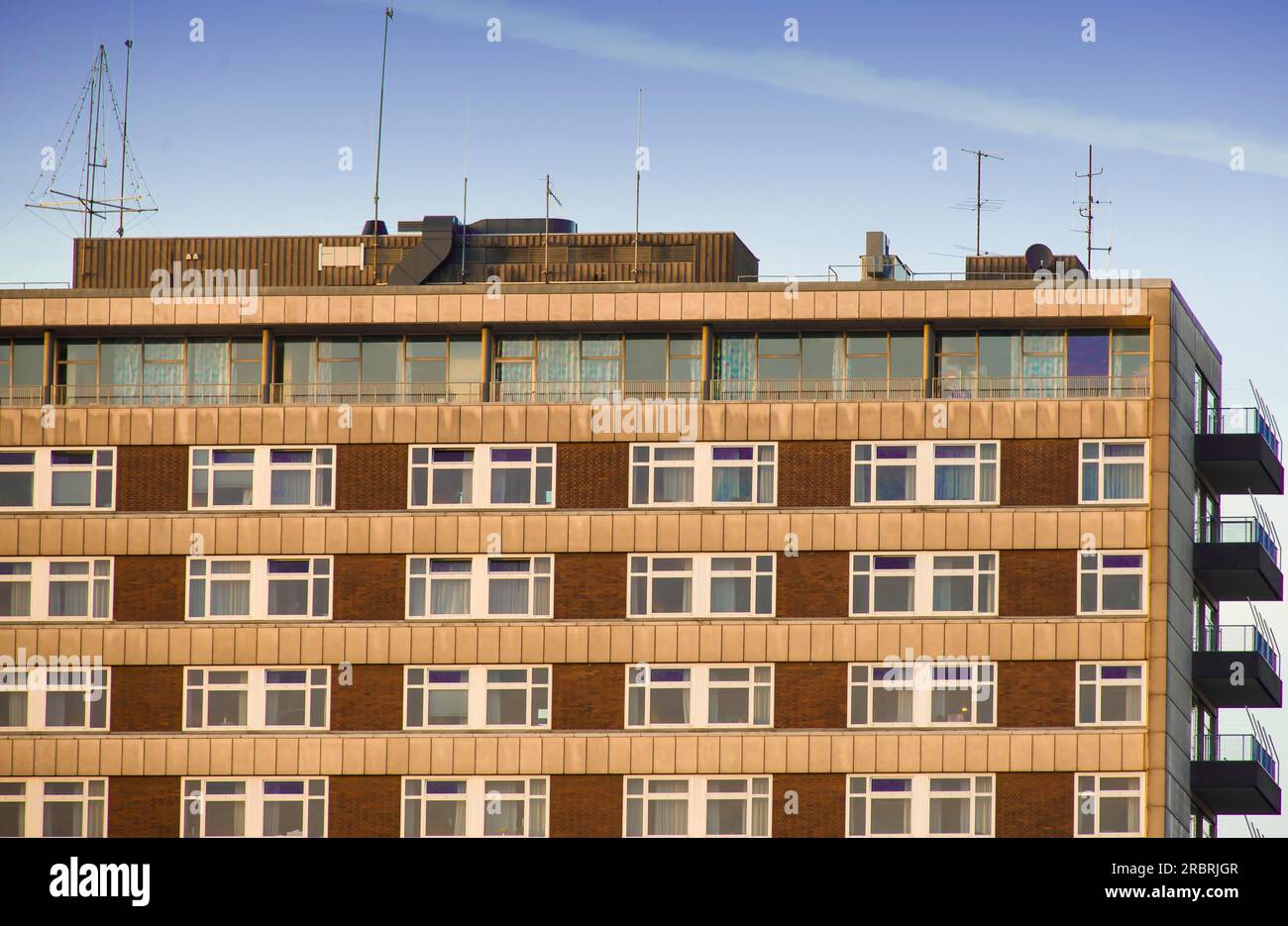 A big apartment block with a lot of windows Stock Photo - Alamy
