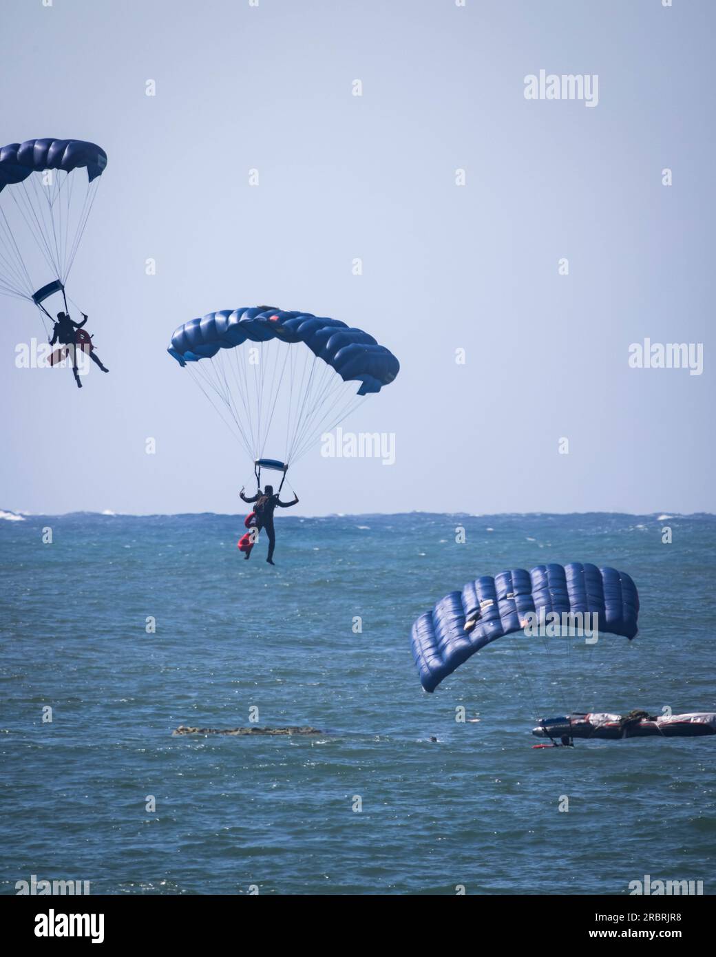 Indonesian Marines conduct a parachuting jump during the rubber duck ...