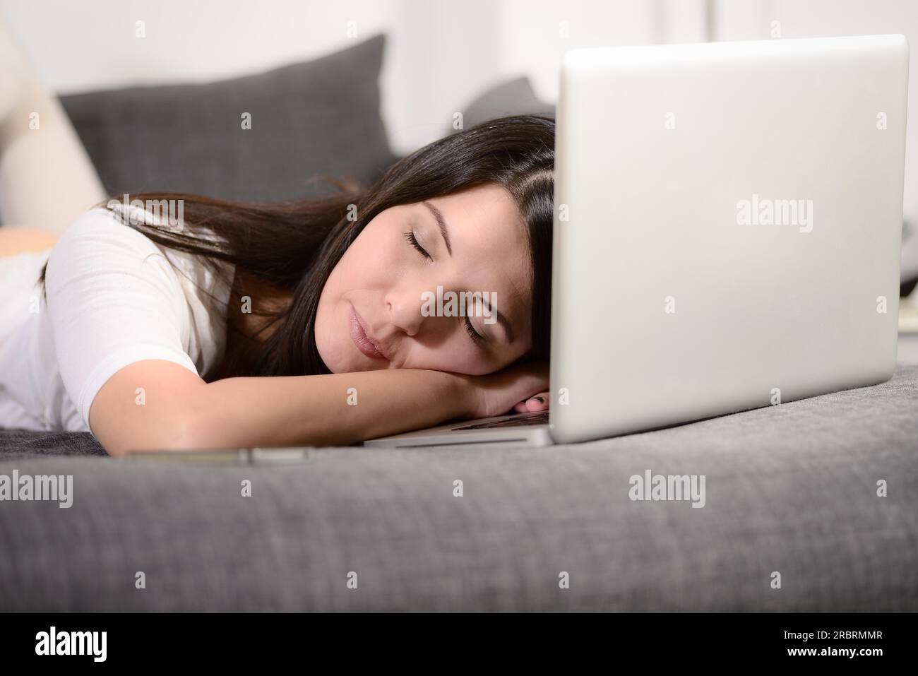 Tired woman fallen asleep over the laptop keyboard Stock Photo - Alamy