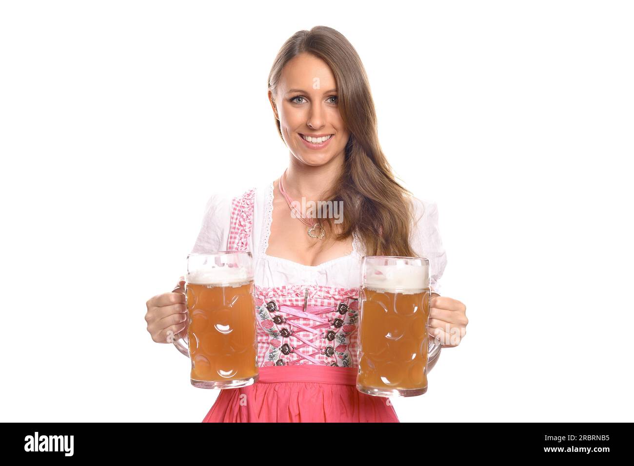 German or Bavarian waitress with her hair in pigtails wearing a ...