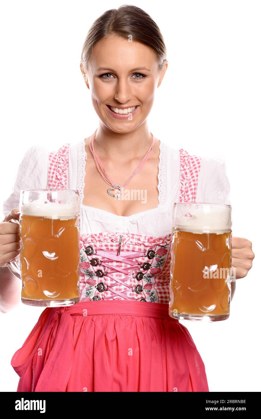 German or Bavarian waitress with her hair in pigtails wearing a ...