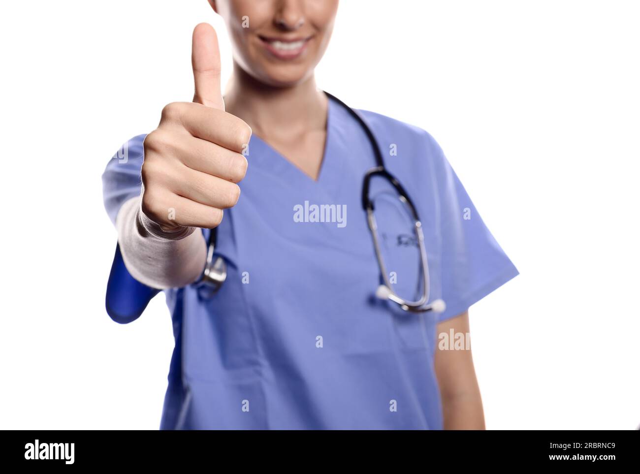 Happy woman doctor giving a thumbs up gesture to show that surgery or ...