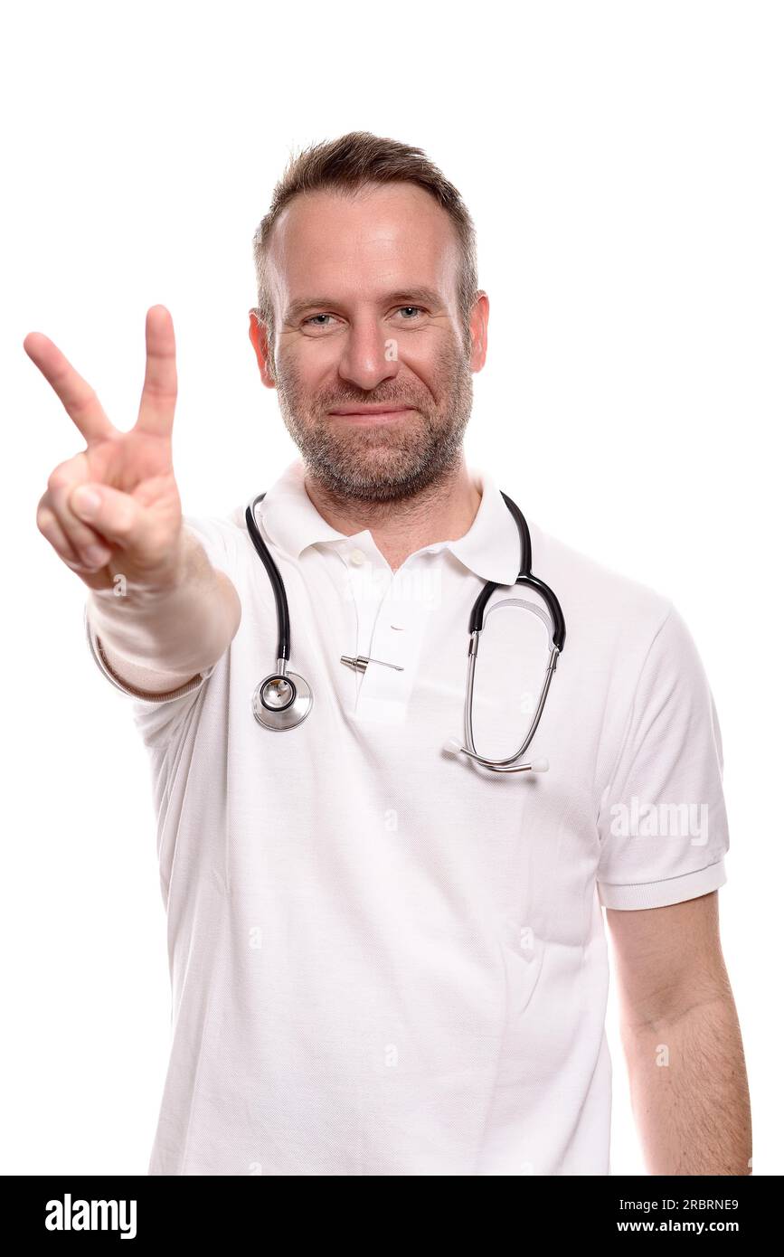 Happy male doctor making a victory gesture to show that surgery or ...