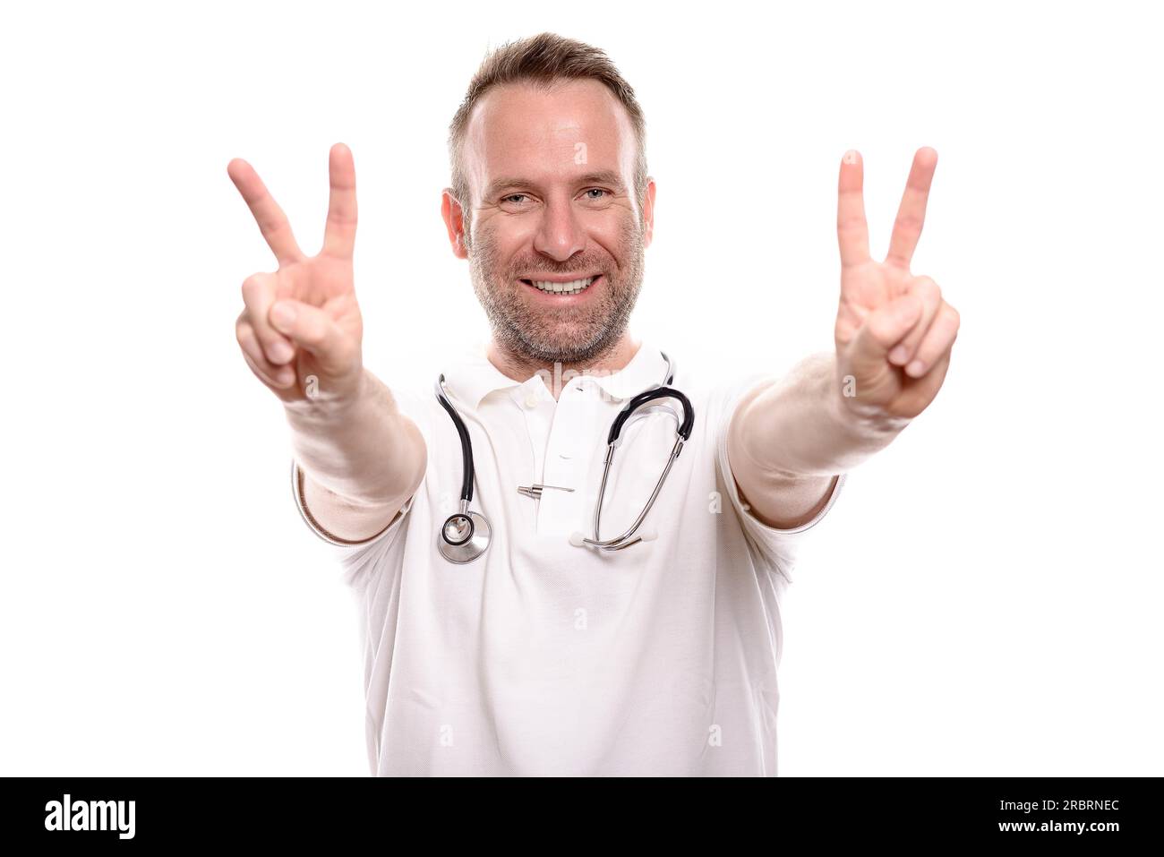 Happy male doctor making a victory gesture to show that surgery or ...