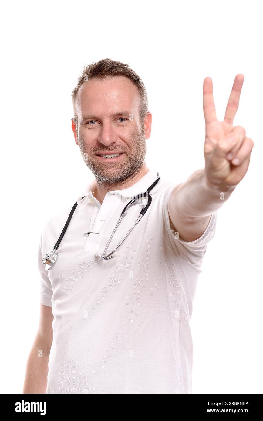Happy male doctor making a victory gesture to show that surgery or ...