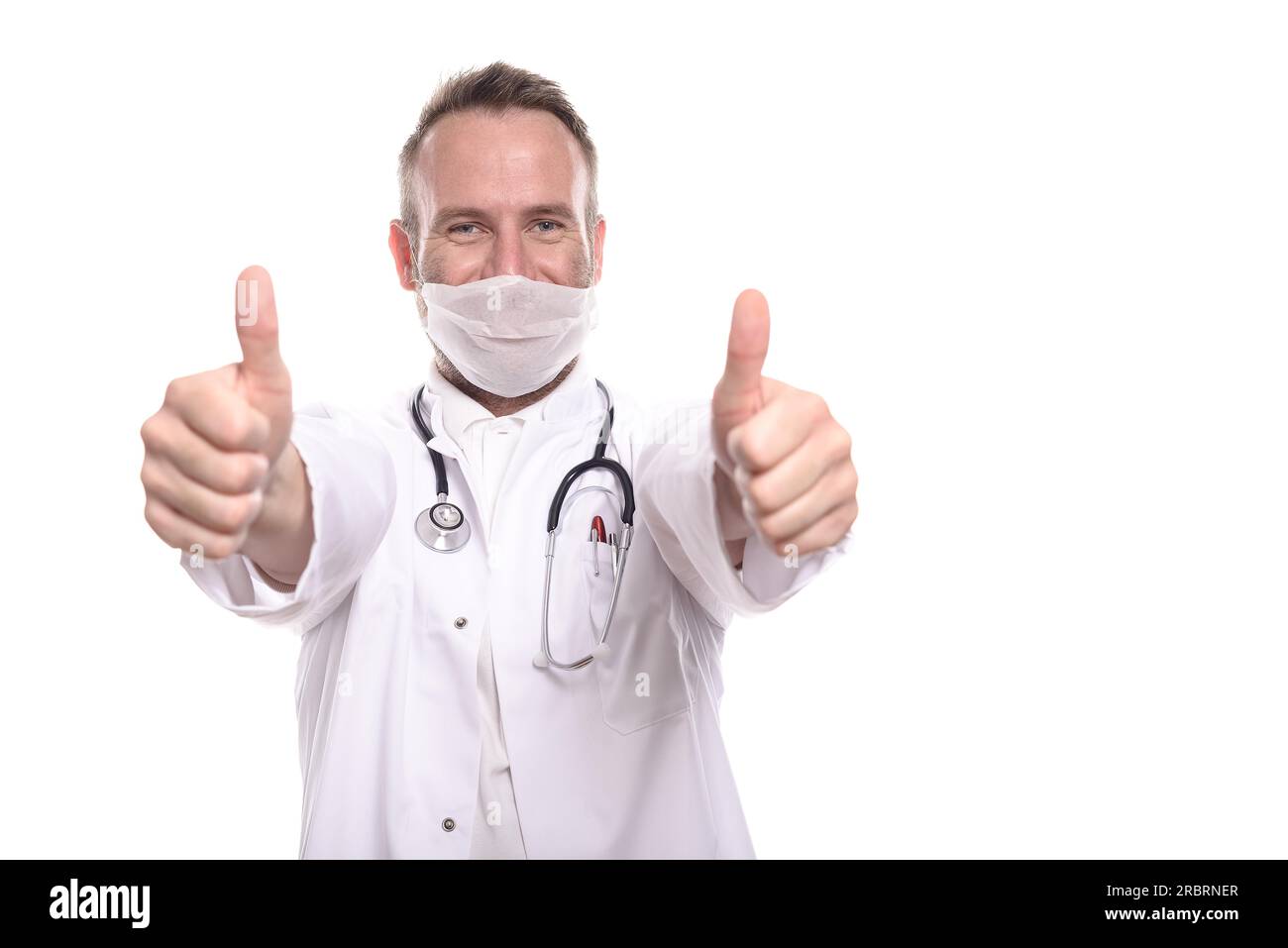 Happy male doctor giving a thumbs up gesture to show that surgery or ...