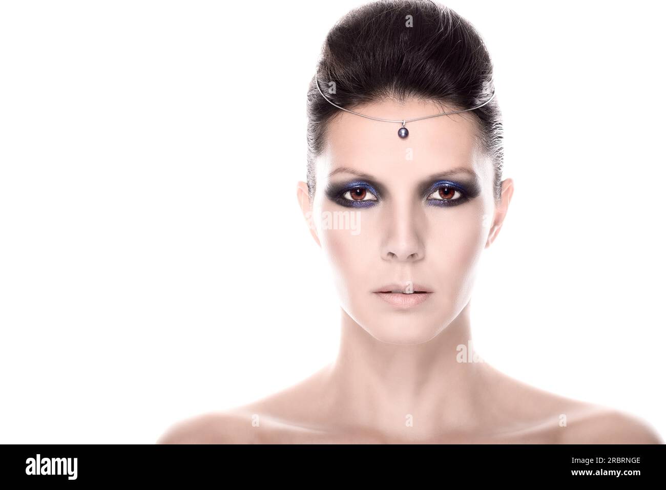 Beautiful female model with serious look on white background Stock ...