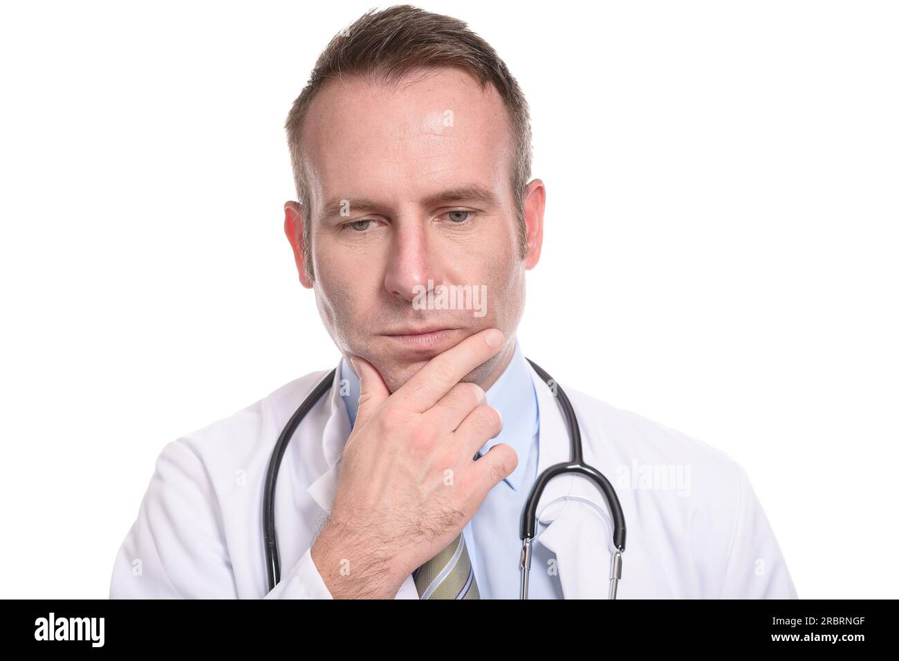 Thoughtful middle-aged male doctor in a white lab coat and stethoscope ...