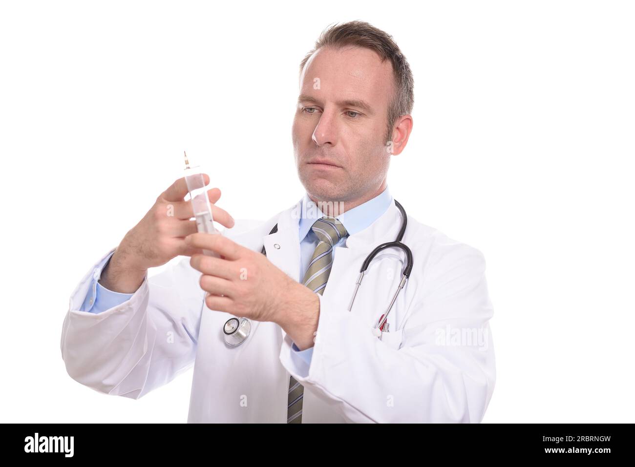 Doctor or male nurse in a lab coat preparing an injection knocking the ...
