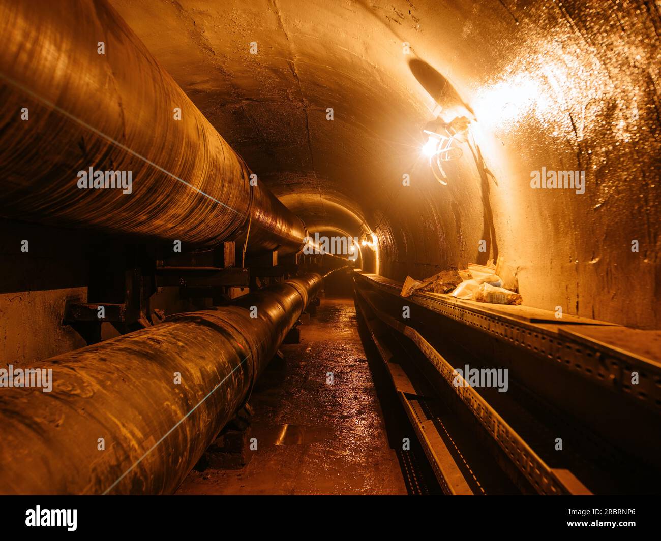 Vaulted concrete underground tunnel of sewer, heating duct or water ...