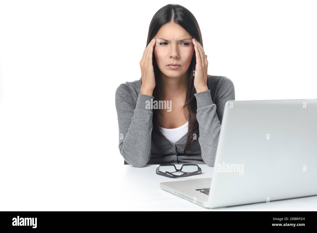 Young Woman Suffers from headache or migraine Facing Laptop on the ...