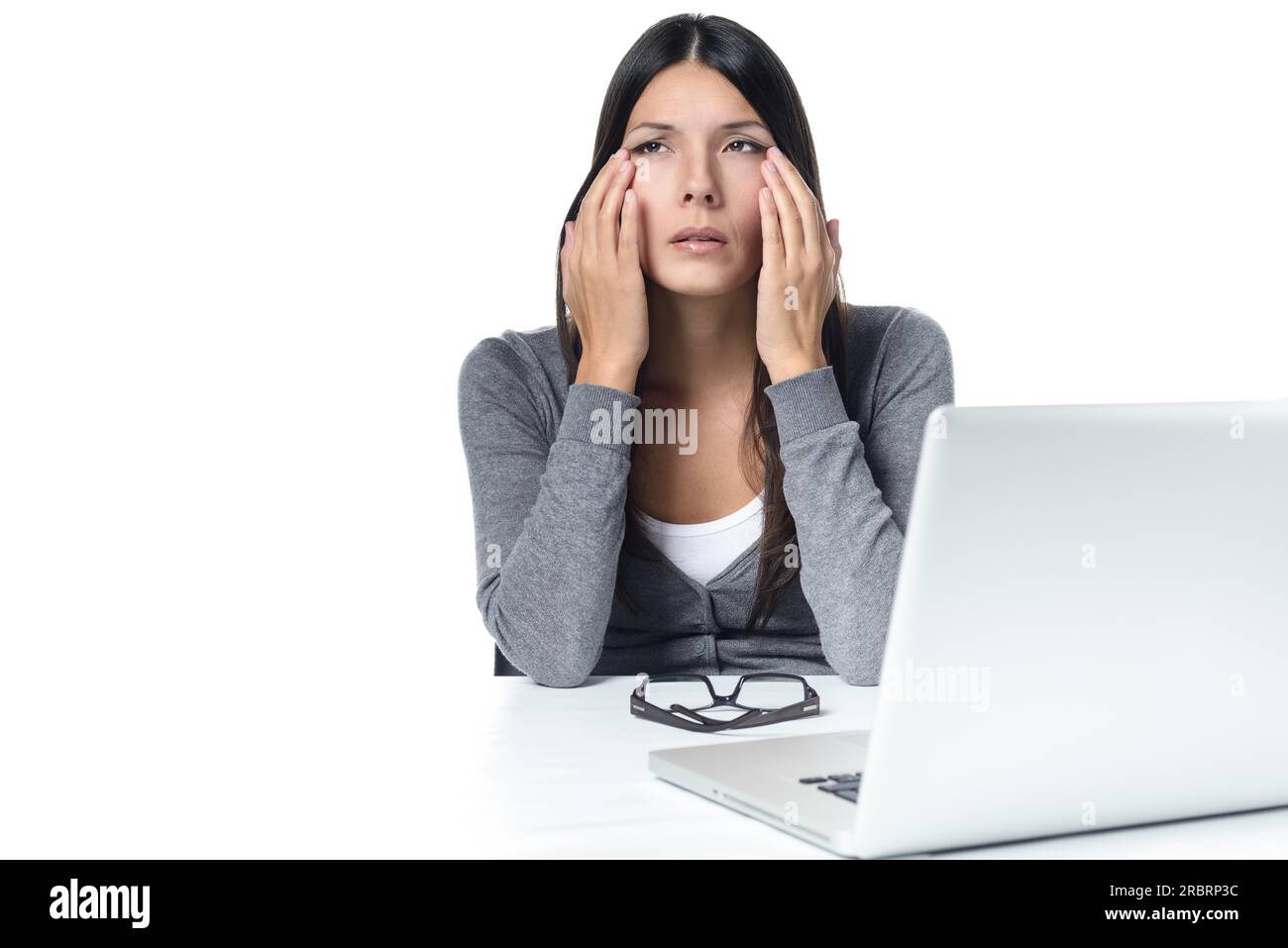 Young Woman Suffers from headache or migraine Facing Laptop on the ...