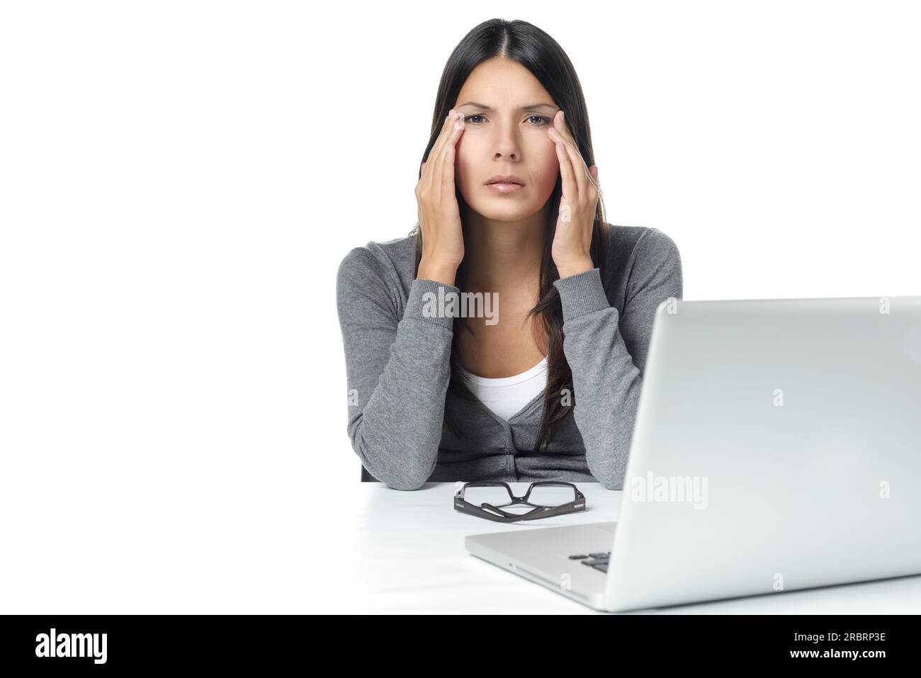 Young Woman Suffers from headache or migraine Facing Laptop on the ...