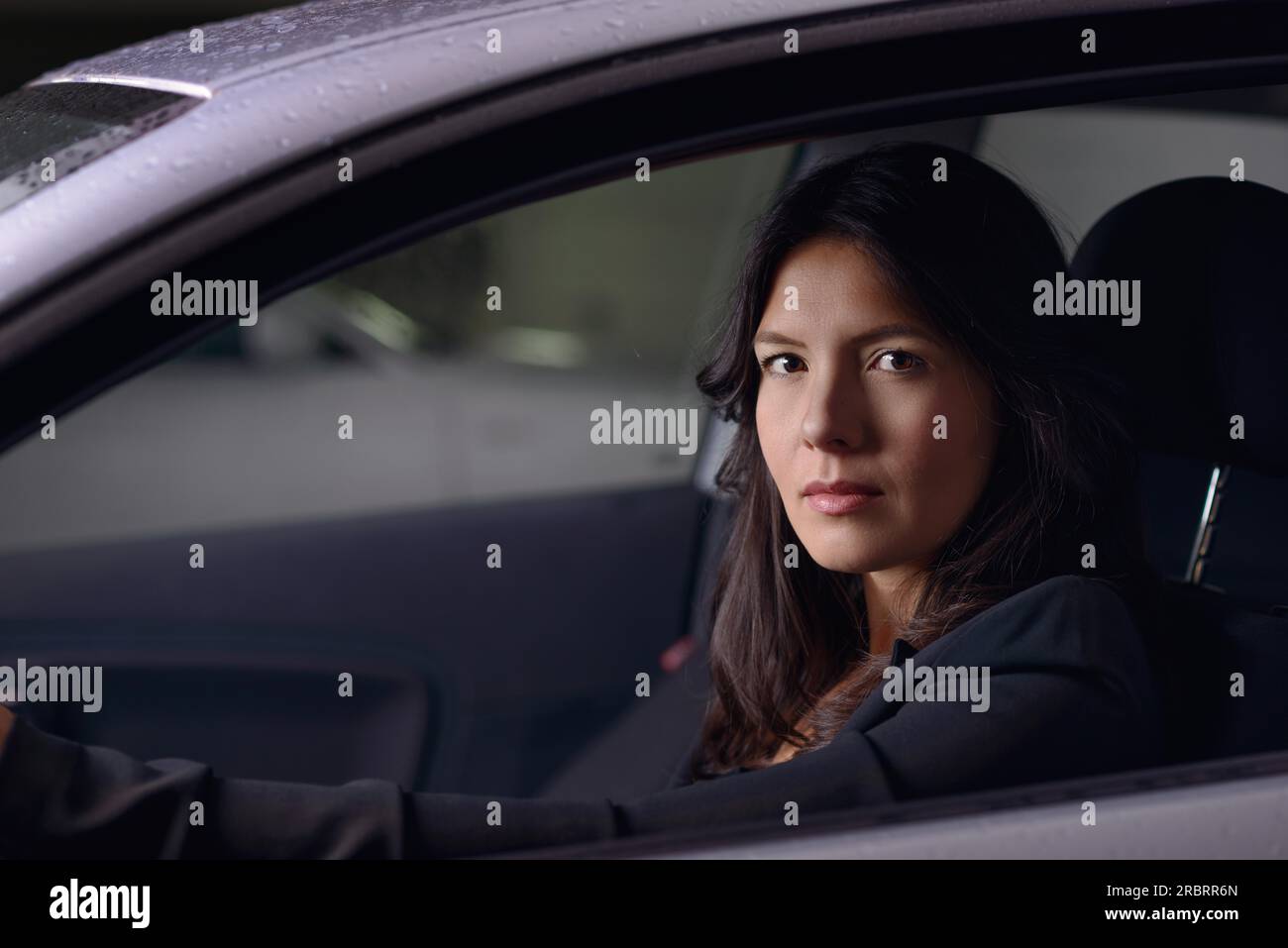 View through the windscreen with reflections of lights of a serious ...