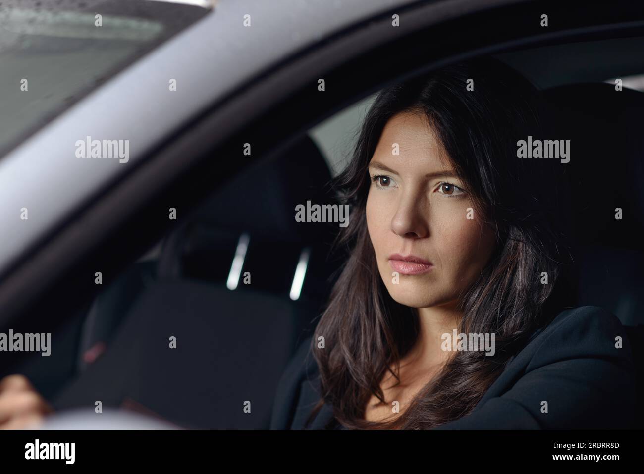 View through the windscreen with reflections of lights of a serious ...