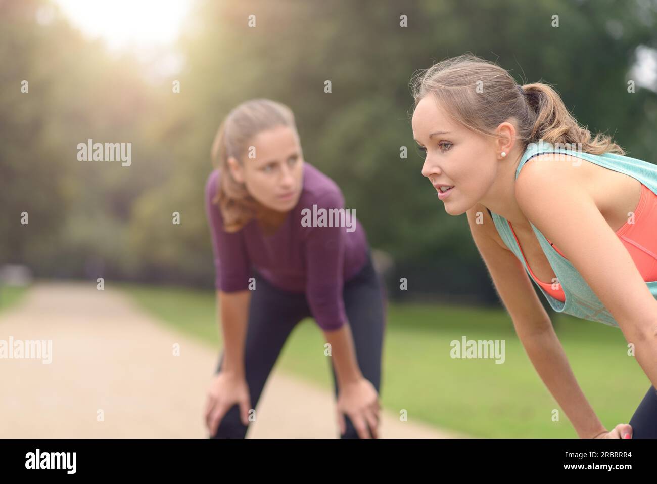 Two Young Women Resting After their Outdoor Physical Exercise at the ...