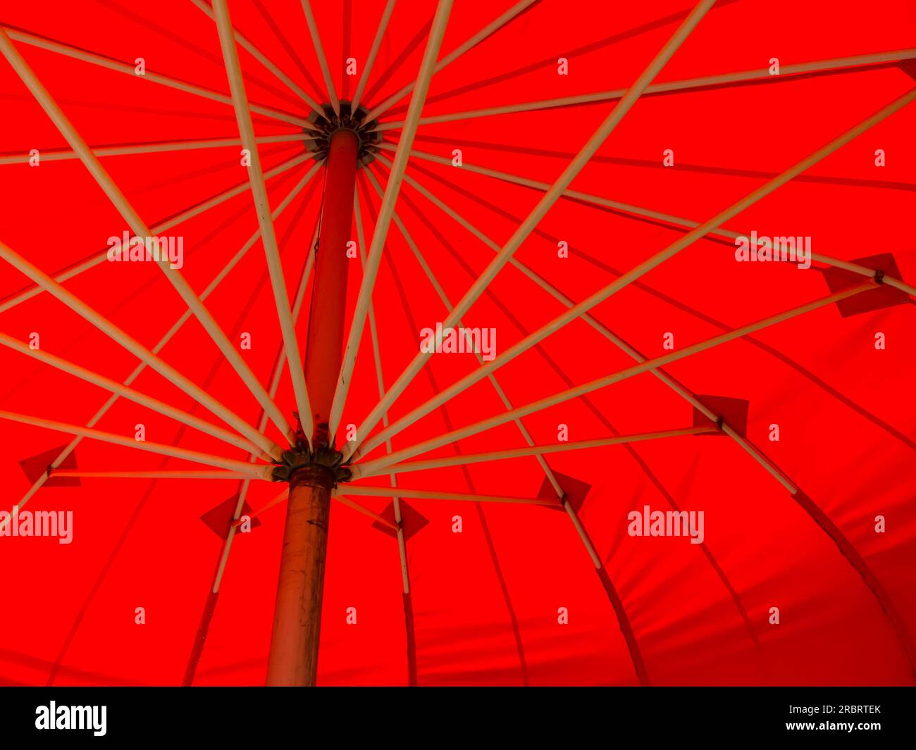An opened red umbrella in an outdoor environment Stock Photo - Alamy