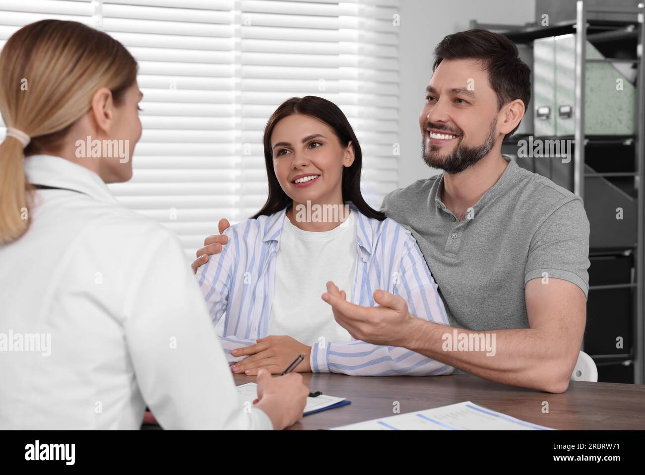 Couple having appointment with fertility doctor in clinic. Patient ...
