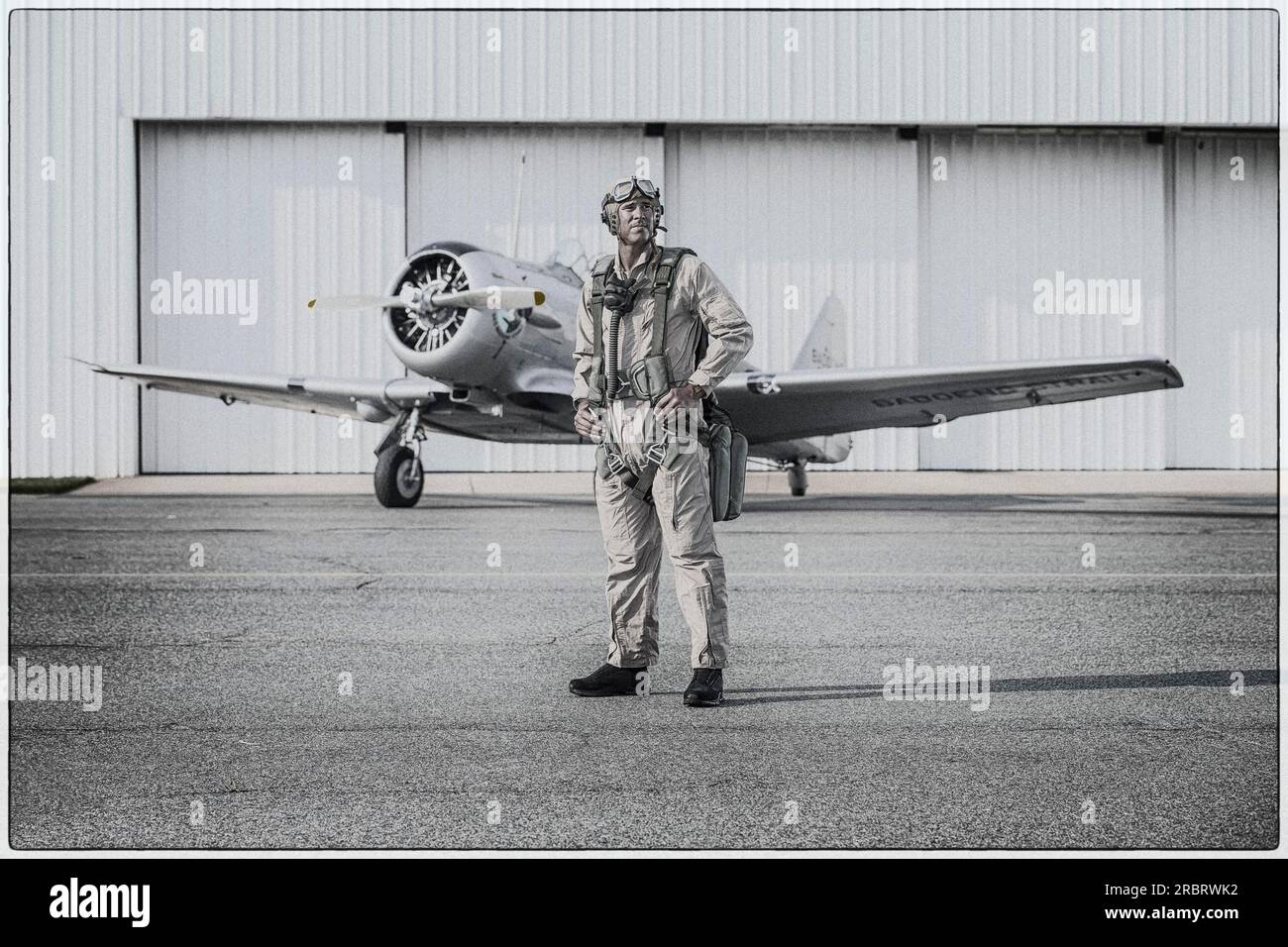 A WWII military pilot with his SNJ5 aircraft returning from a mission ...