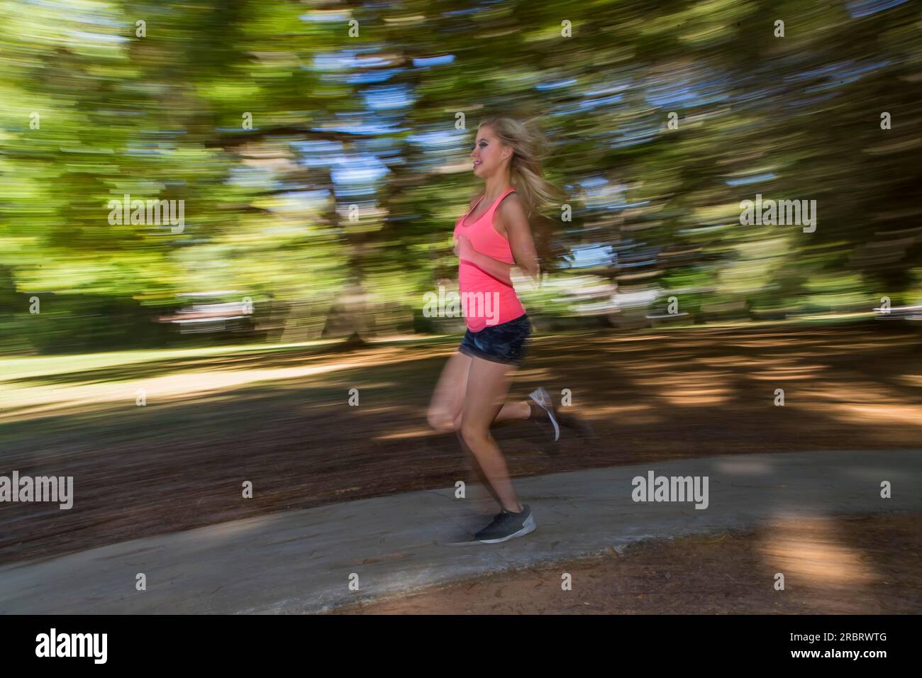 Female runner running through forest hi-res stock photography and ...