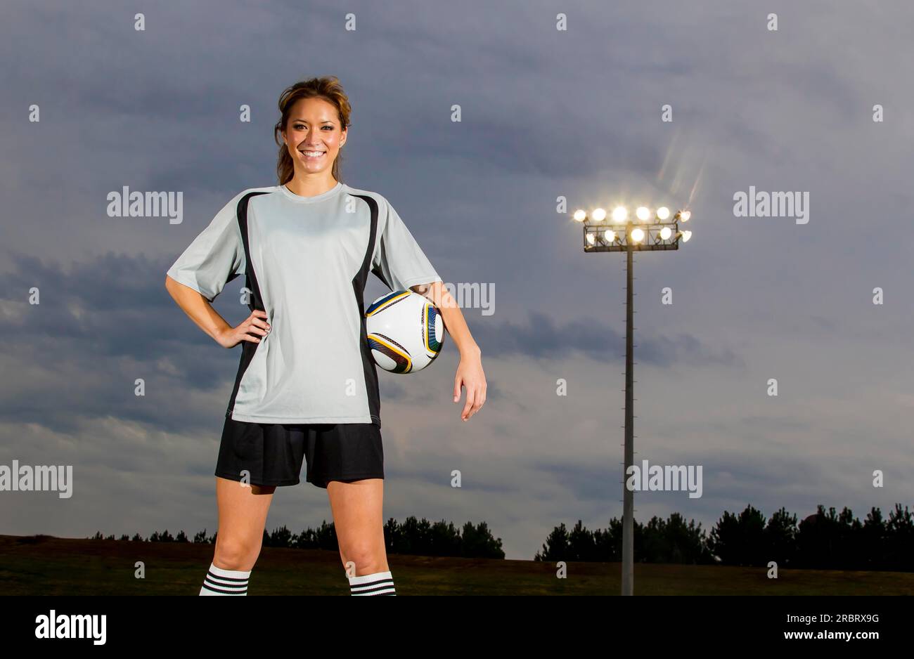 Female soccer player working out on a soccer field Stock Photo - Alamy