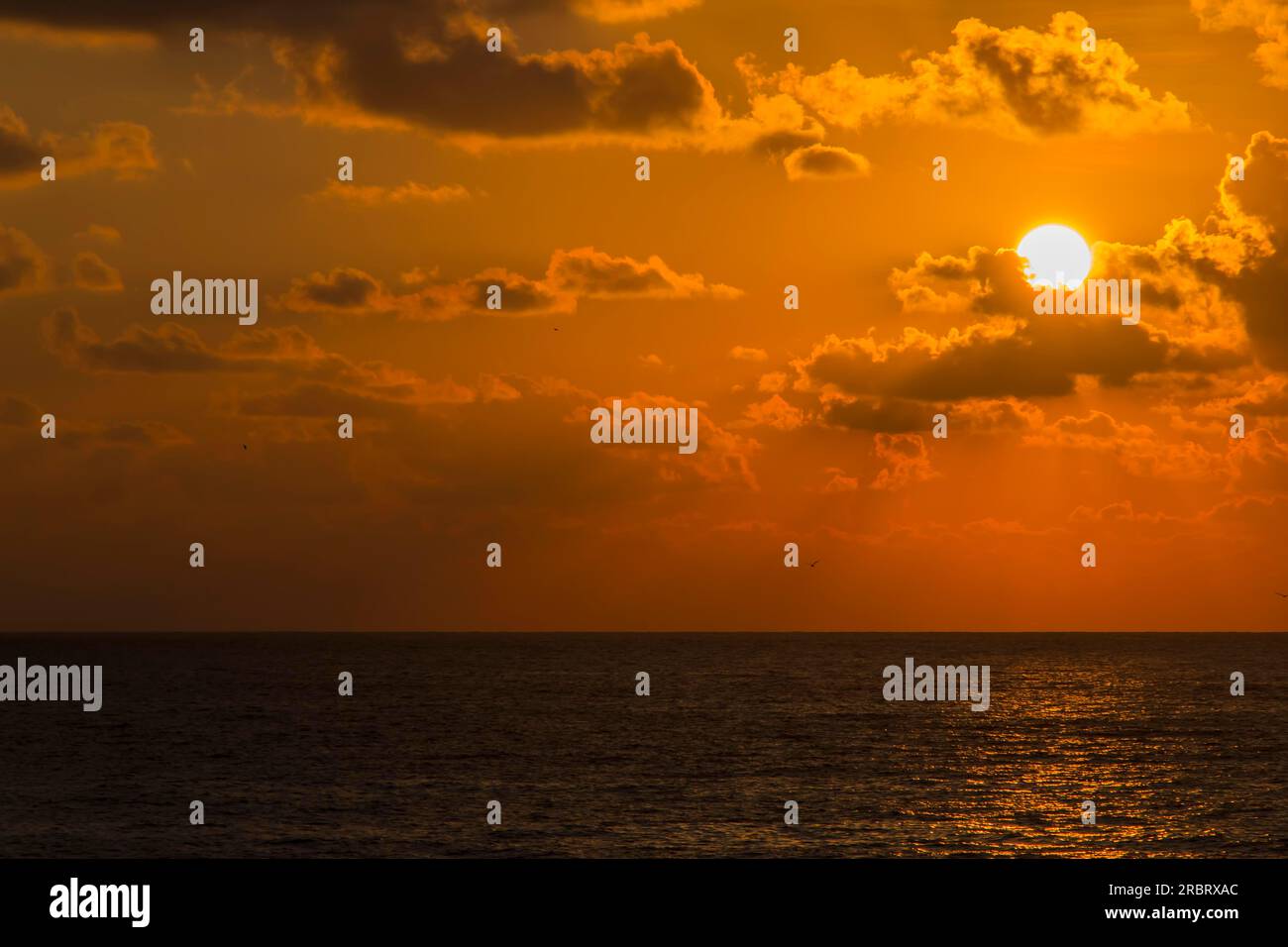 Sunrise on the ocean Stock Photo - Alamy