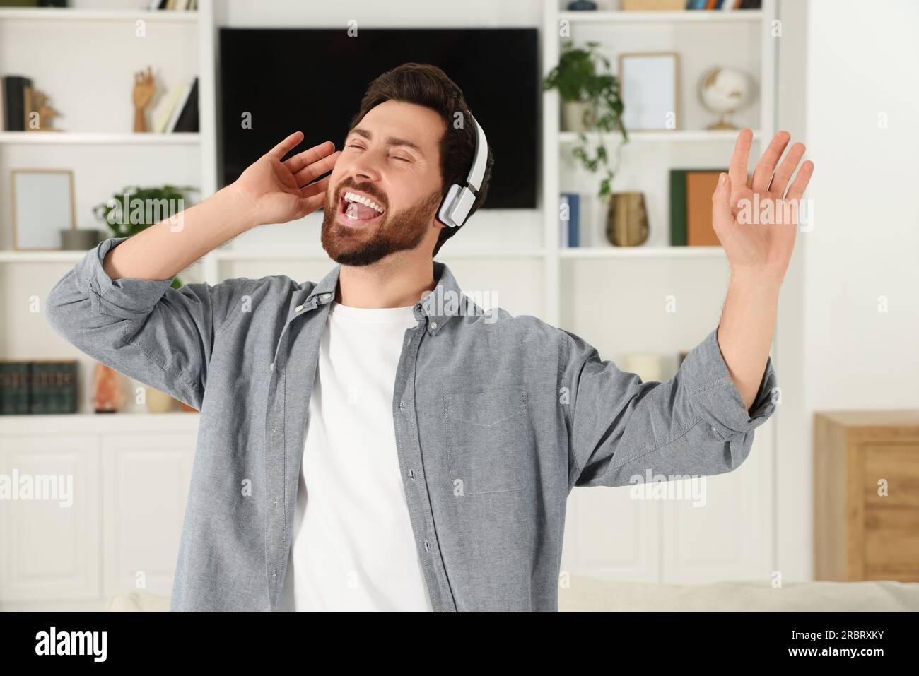 Guy dancing singing listening music hi-res stock photography and images ...