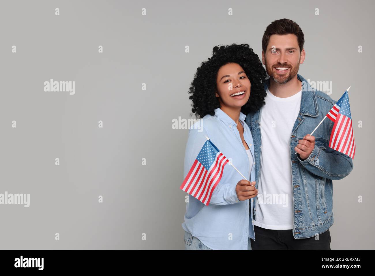 4th of July - Independence Day of USA. Happy couple with American flags ...